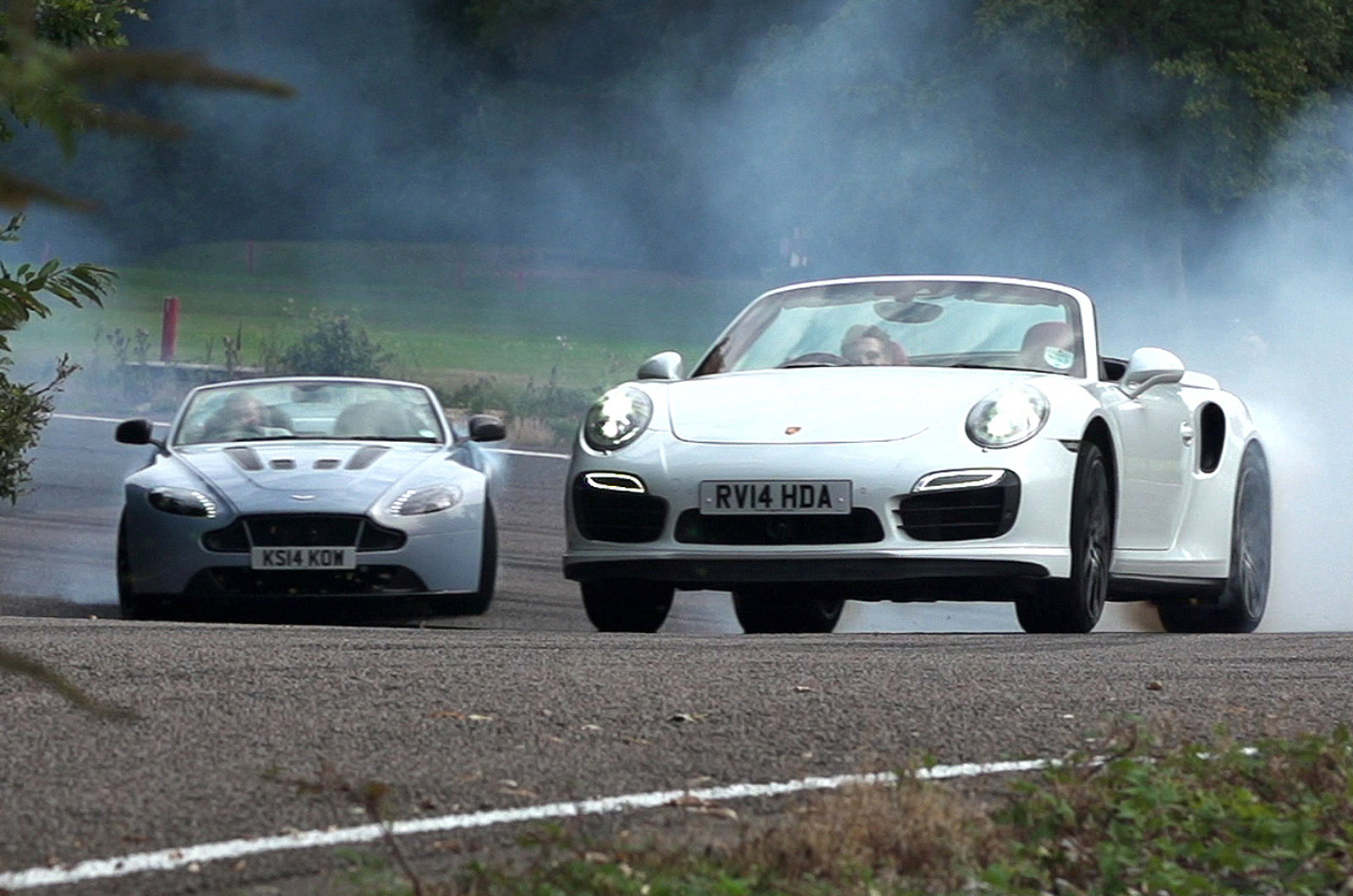 Video: Porsche 911 Turbo S versus Aston Martin V12 Vantage S | Autocar